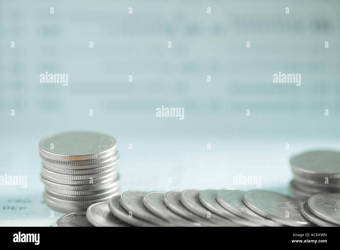 Stacks of coins and account book or credit card with copy space ...