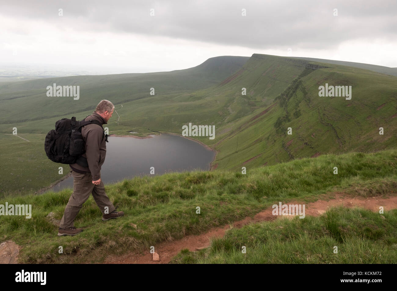 Hill walker wild camps near Llyn y Fan Fawr lake and hikes the peaks ...