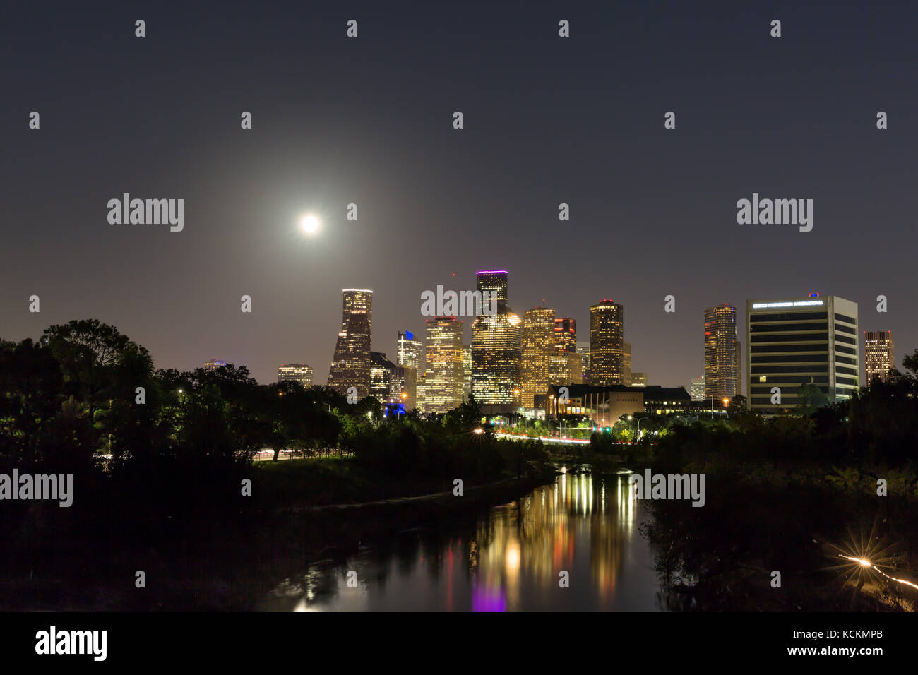 Houston downtown skylines refelection with full moon Stock Photo - Alamy