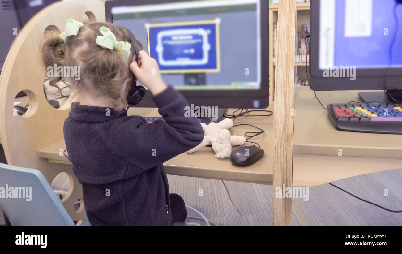 Little girl playing educational games on the computer Stock Photo - Alamy