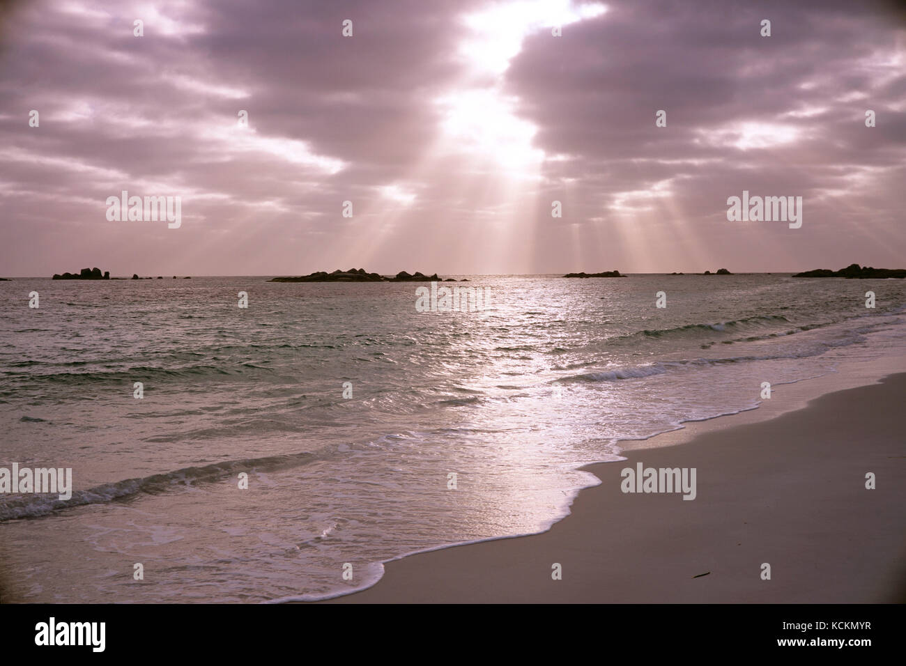Sun about to break through early morning cloud (slanting rays), north ...