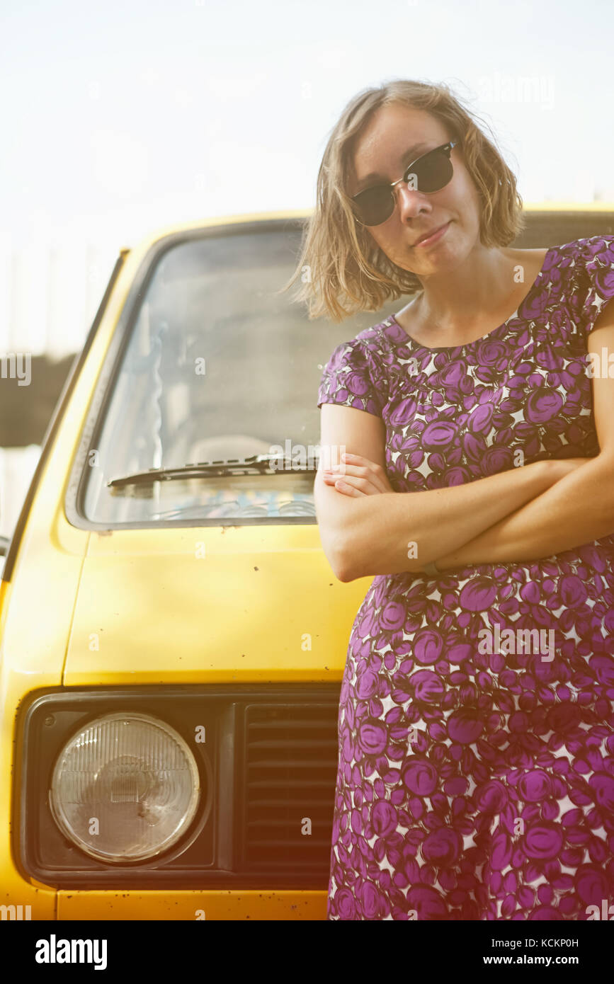 Dreaming girl leaning on van Stock Photo - Alamy