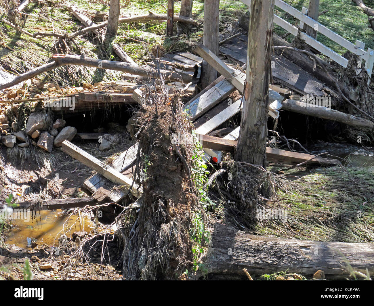 Flood destruction, remains of a bridge washed away during flash ...