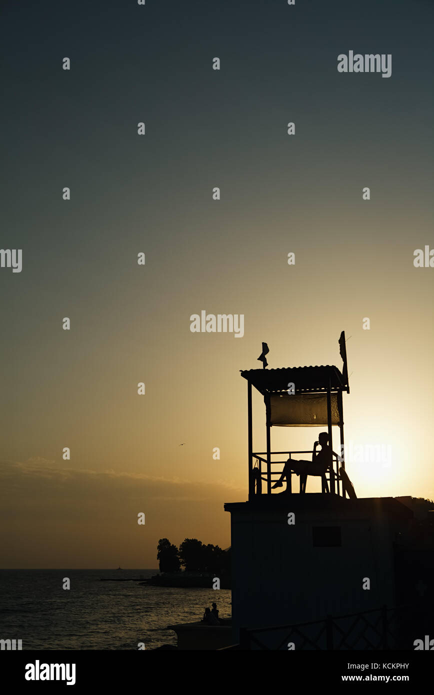 Anonymous person sitting in observation tower Stock Photo - Alamy