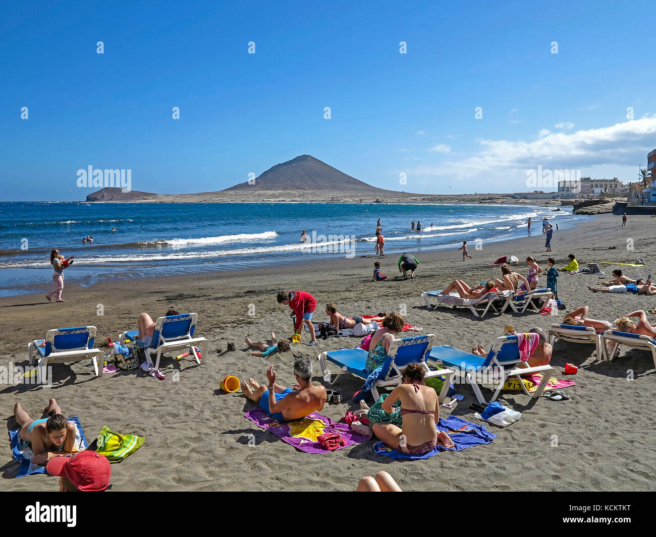 Families on beach Beach and Mount Montana Roja in the background ...