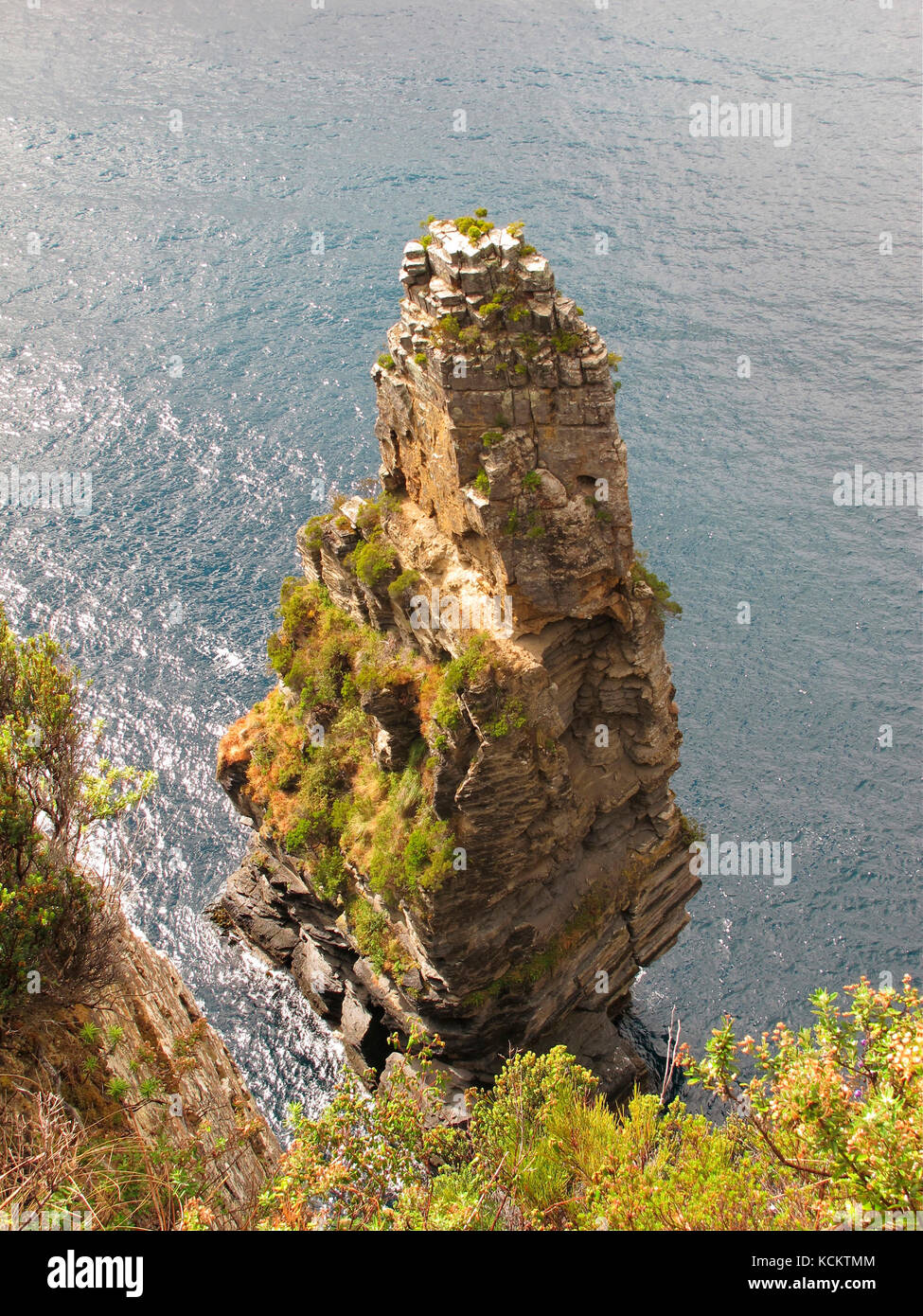 An unnamed sea stack, one of several rock features created by erosion ...