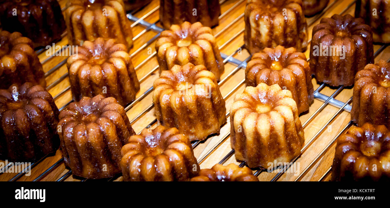 French Pastry Canneles. Preparation of a Breton specialty Stock Photo ...