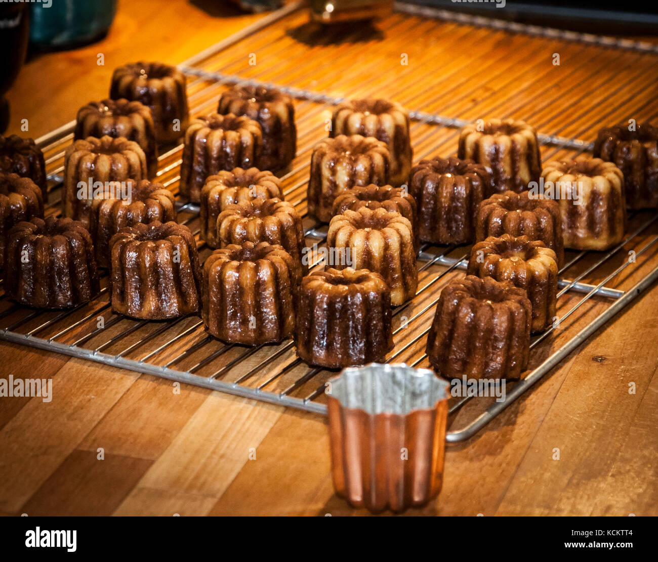 French Pastry Canneles. Preparation of a Breton specialty Stock Photo ...