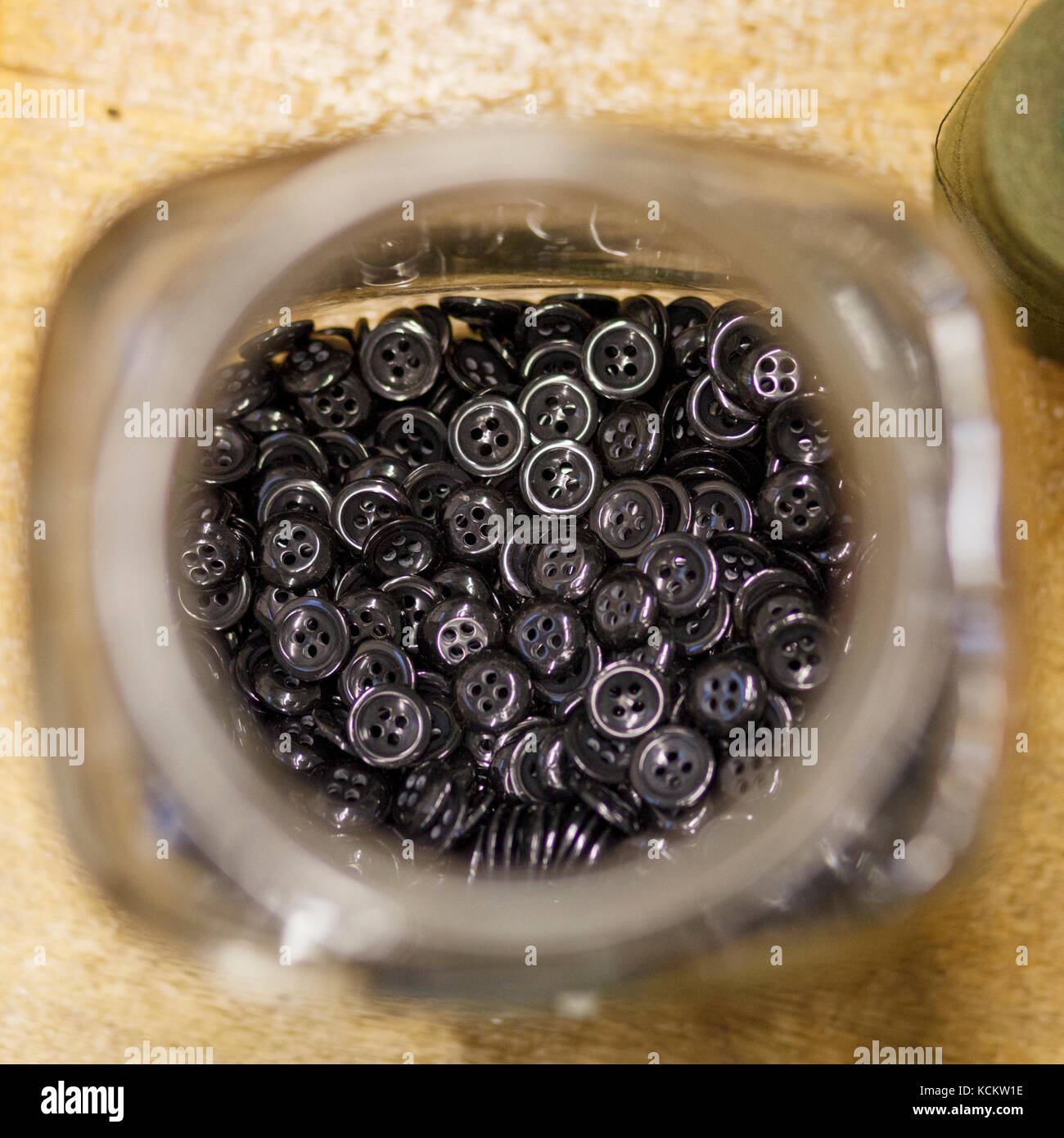 A jar full of buttons Stock Photo - Alamy