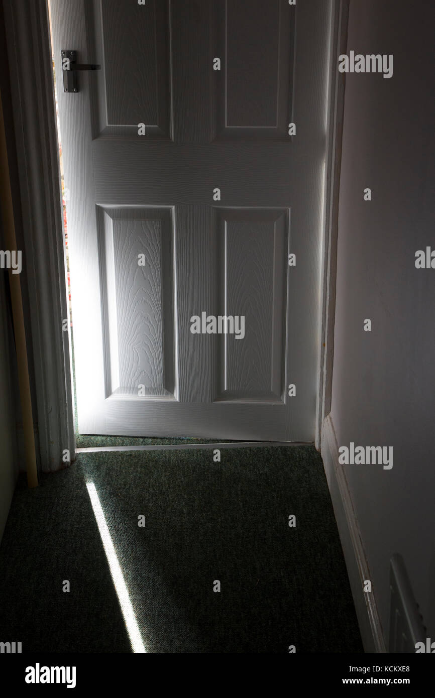 Shaft of sunlight falling on floor through slightly open modern B&Q ...