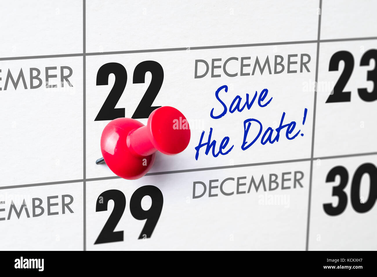 Wall calendar with a red pin - December 22 Stock Photo - Alamy