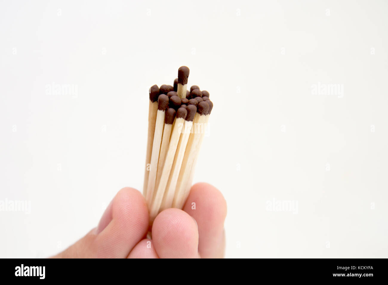 A man holds many matches in his hand Stock Photo - Alamy