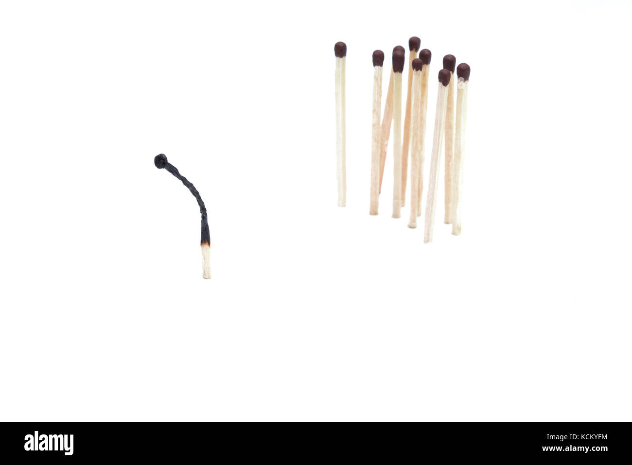 Many matches standing against a white background Stock Photo - Alamy