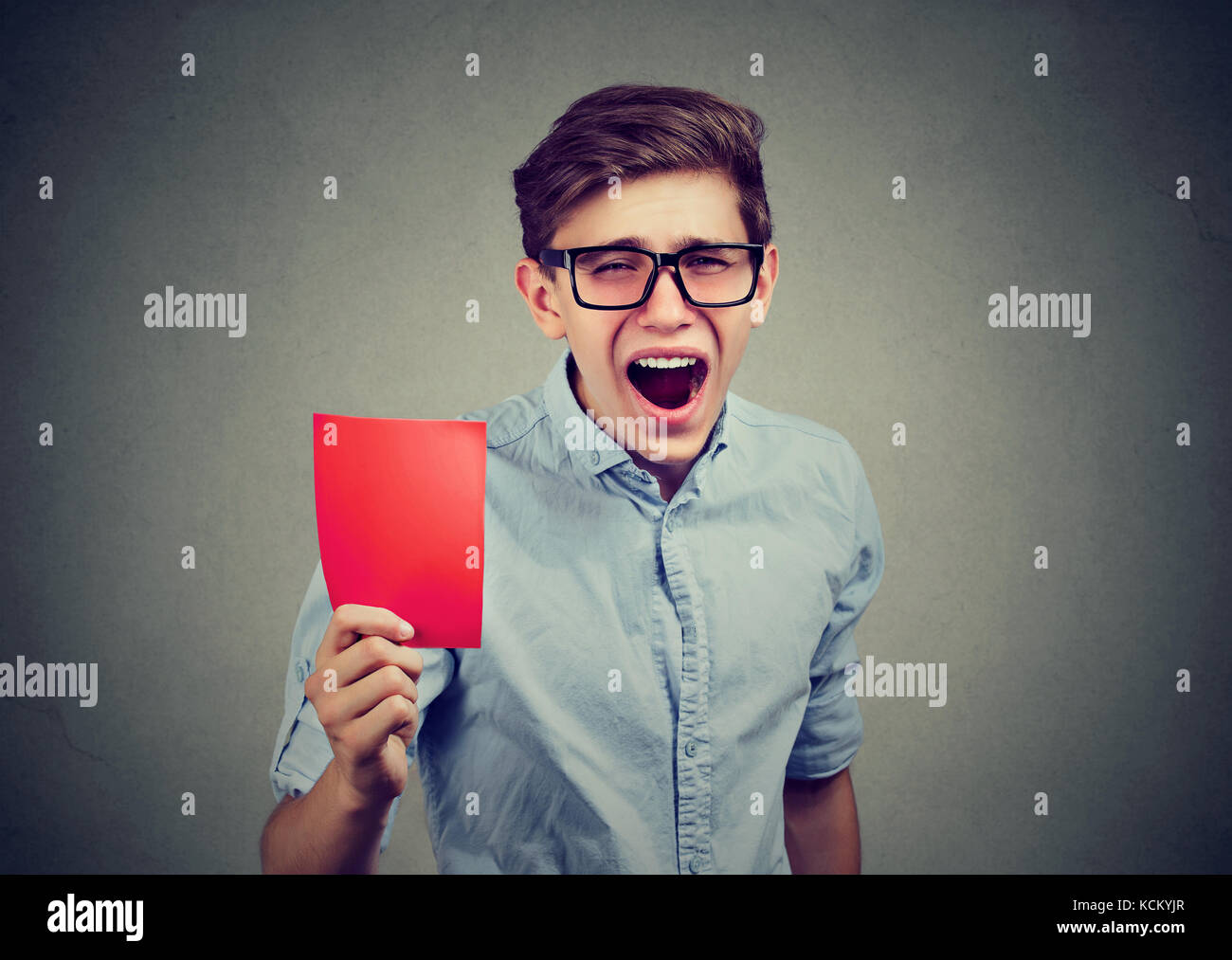 Young referee showing a red card Stock Photo - Alamy
