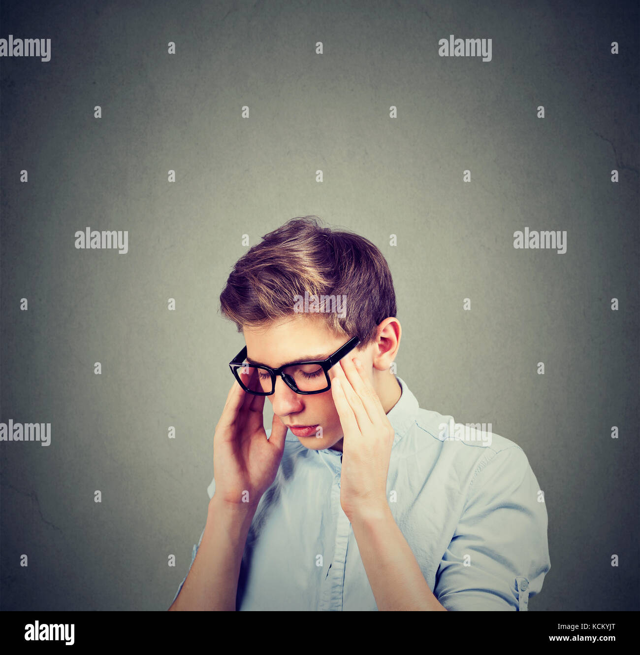 Thoughtful stressed man with tensed face expression looking down ...