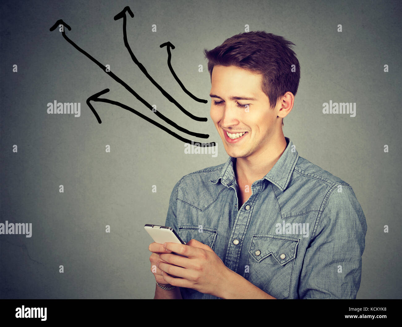 Happy man using mobile phone texting sending messages Stock Photo - Alamy