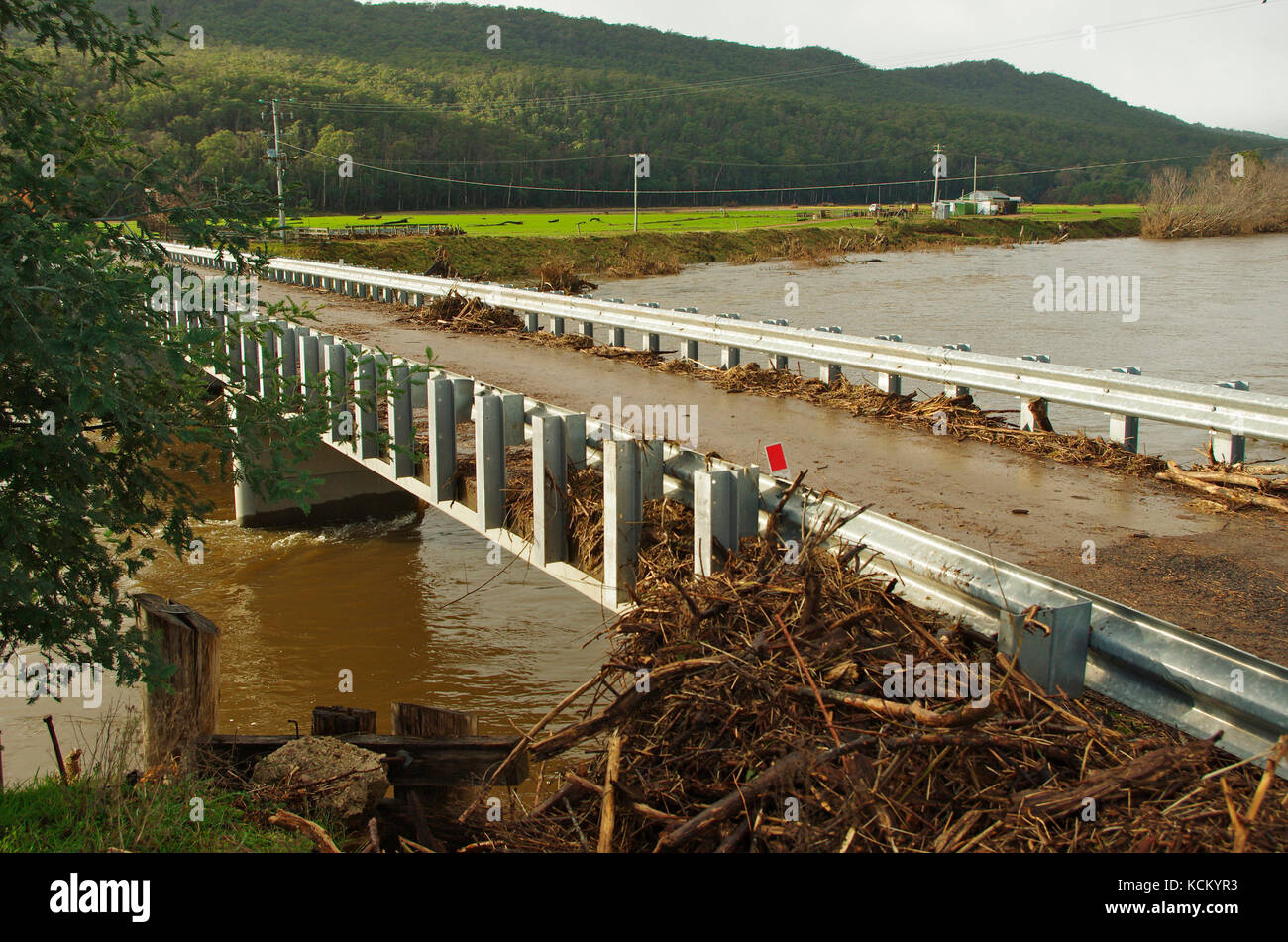 Flood debris washed up against Lamberts Bridge as flood waters recede ...