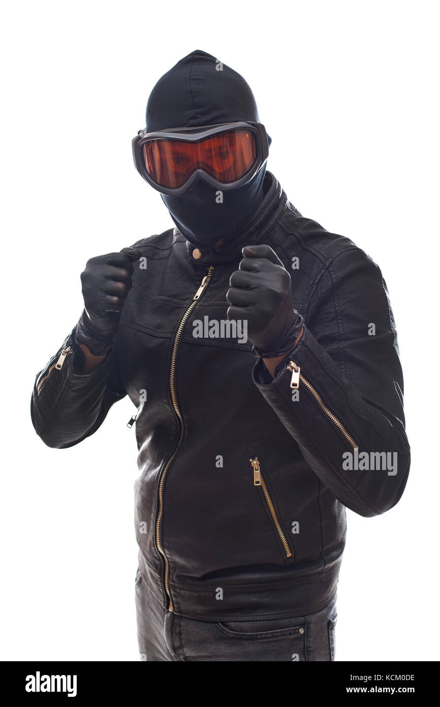 Dangerous burglar dressed in black wearing a mask on head - isolated ...