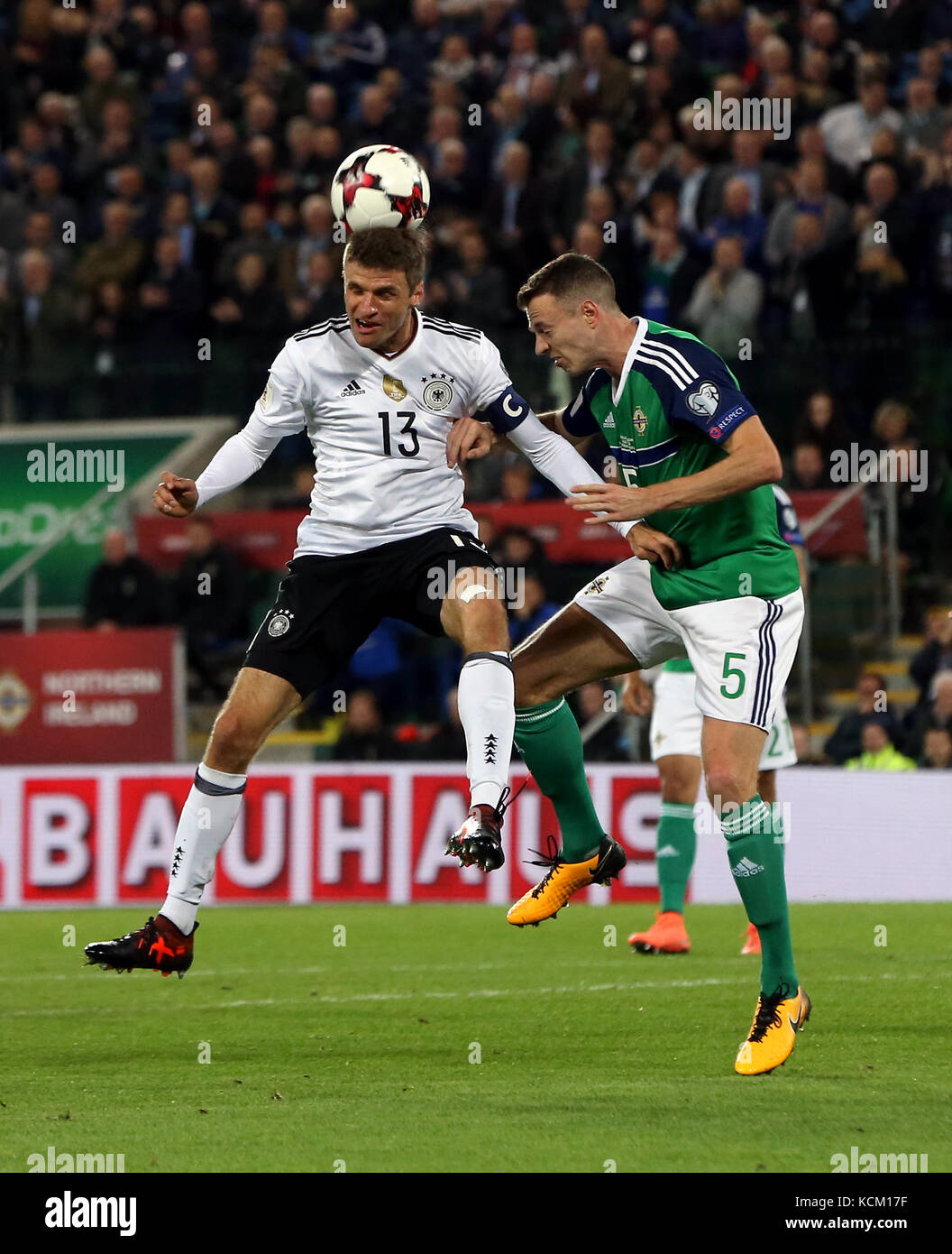 Germany's Thomas Muller (left) and Northern Ireland's Jonny Evans ...