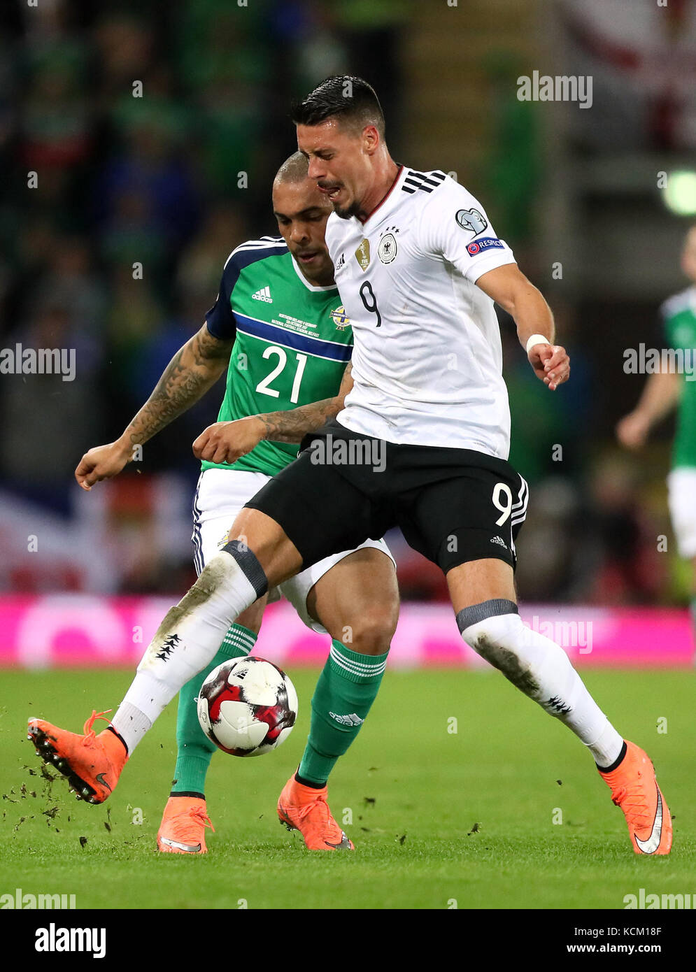 Northern Ireland's Josh Magennis (left) and Germany's Sandro Wagner ...