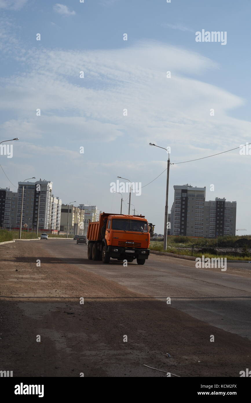 Modern Russian Kamaz vehicle travels along an empty Russian road or ...
