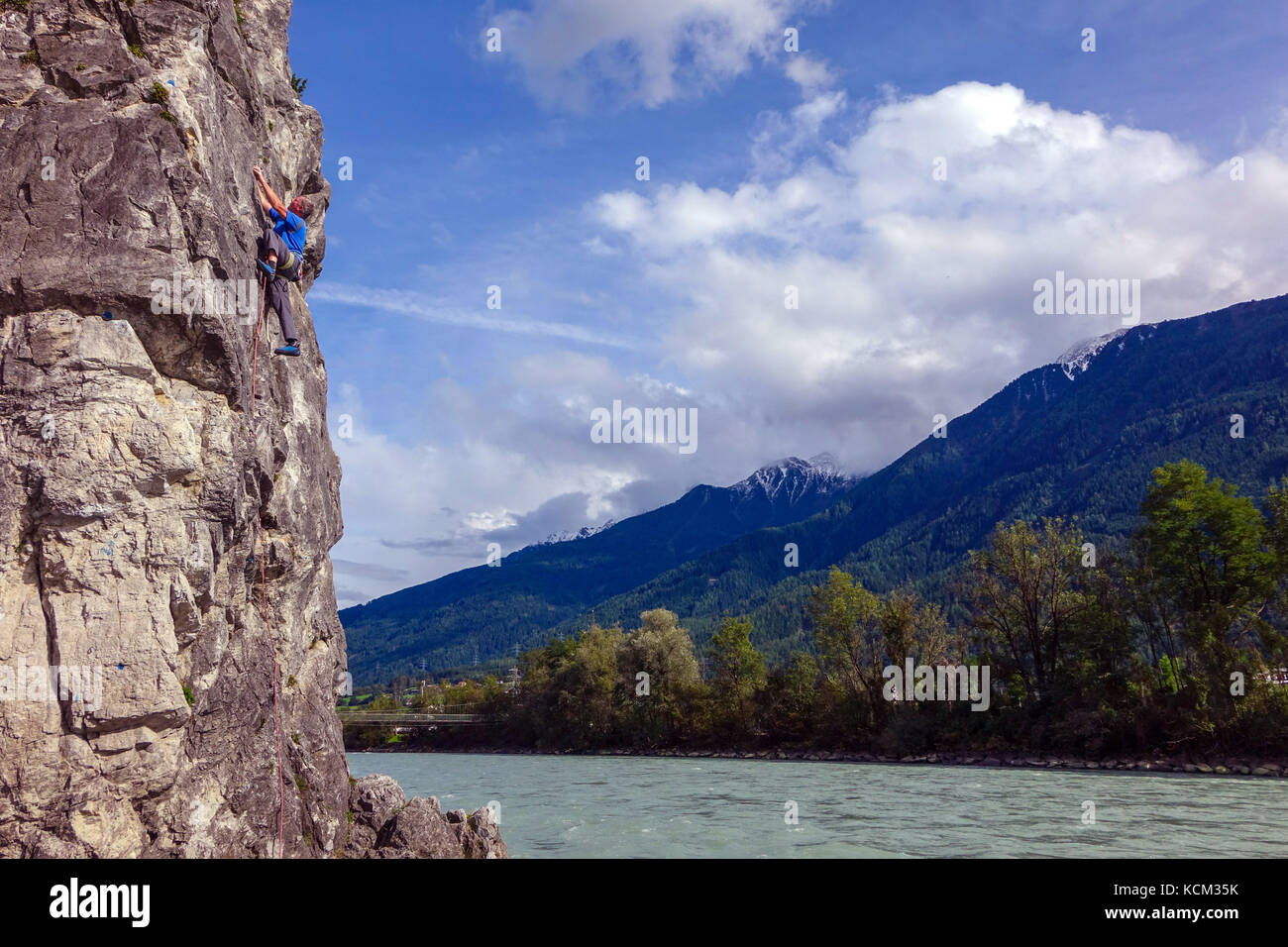 Solitary rock climber on steep rock face, cliff Stock Photo - Alamy