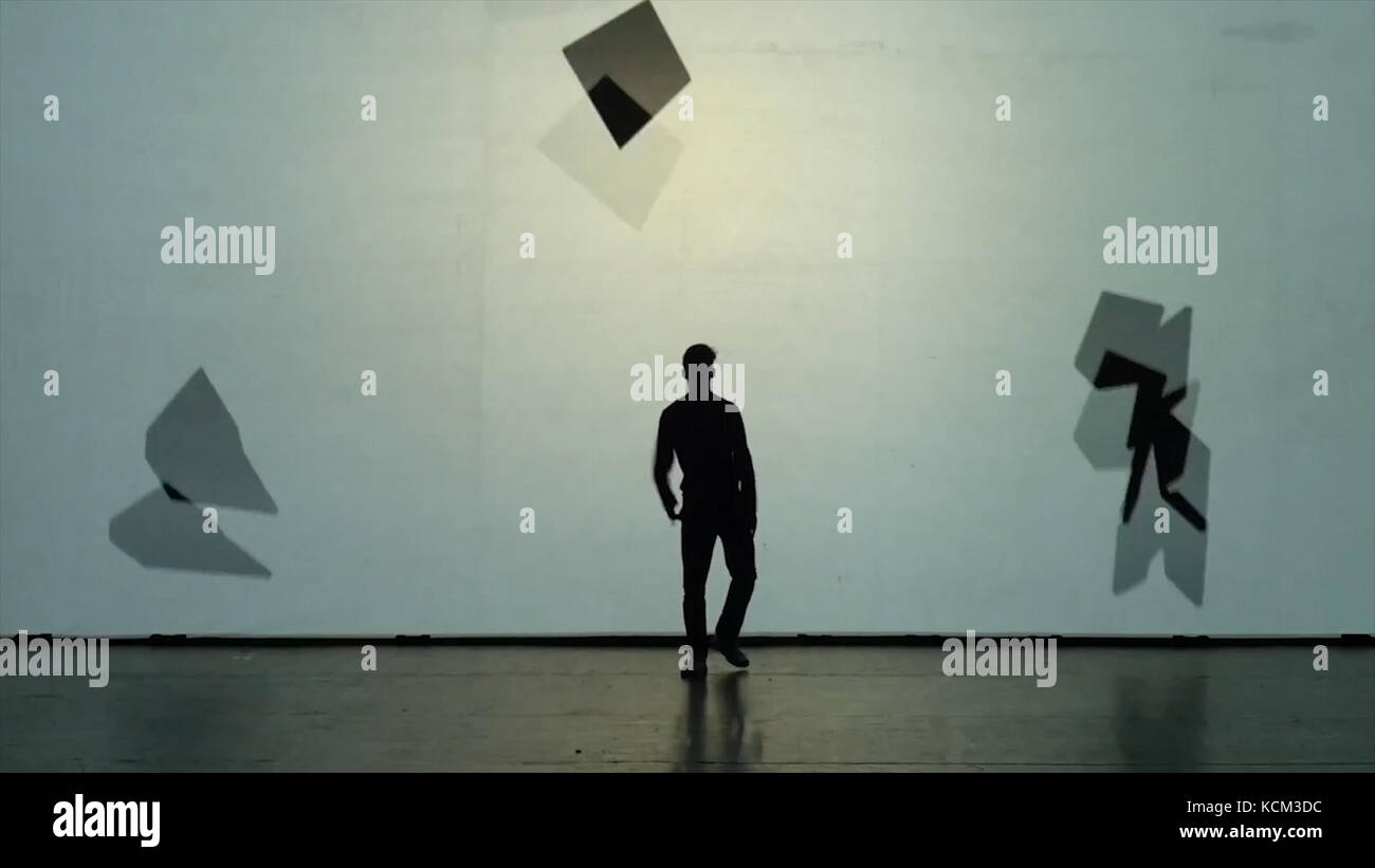 Dance of shadows. Dancers dancing on the stage. Dancers silhouettes ...