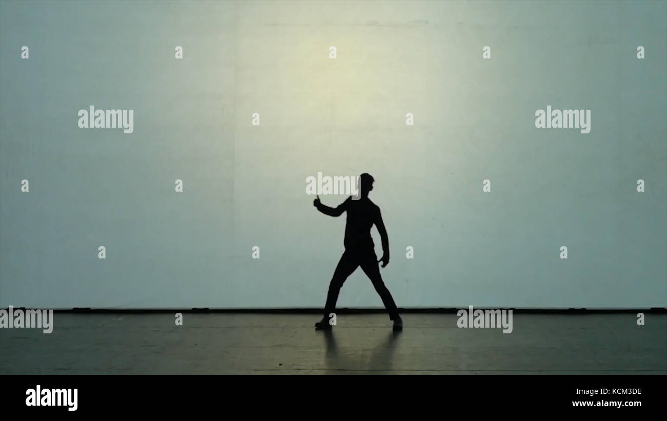 Dance of shadows. Dancers dancing on the stage. Dancers silhouettes ...
