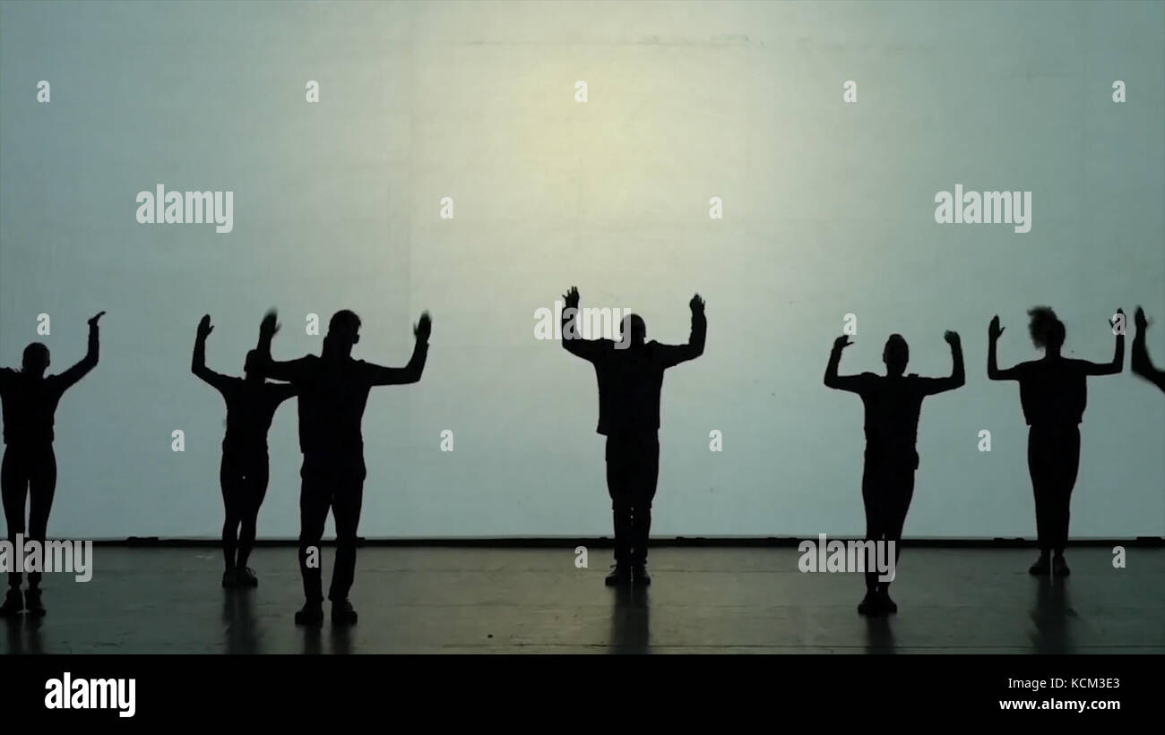 Dance of shadows. Dancers dancing on the stage. Dancers silhouettes ...