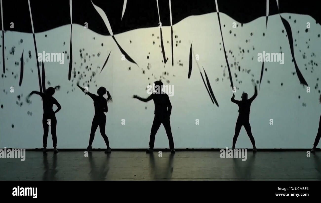 Dance of shadows. Dancers dancing on the stage. Dancers silhouettes ...