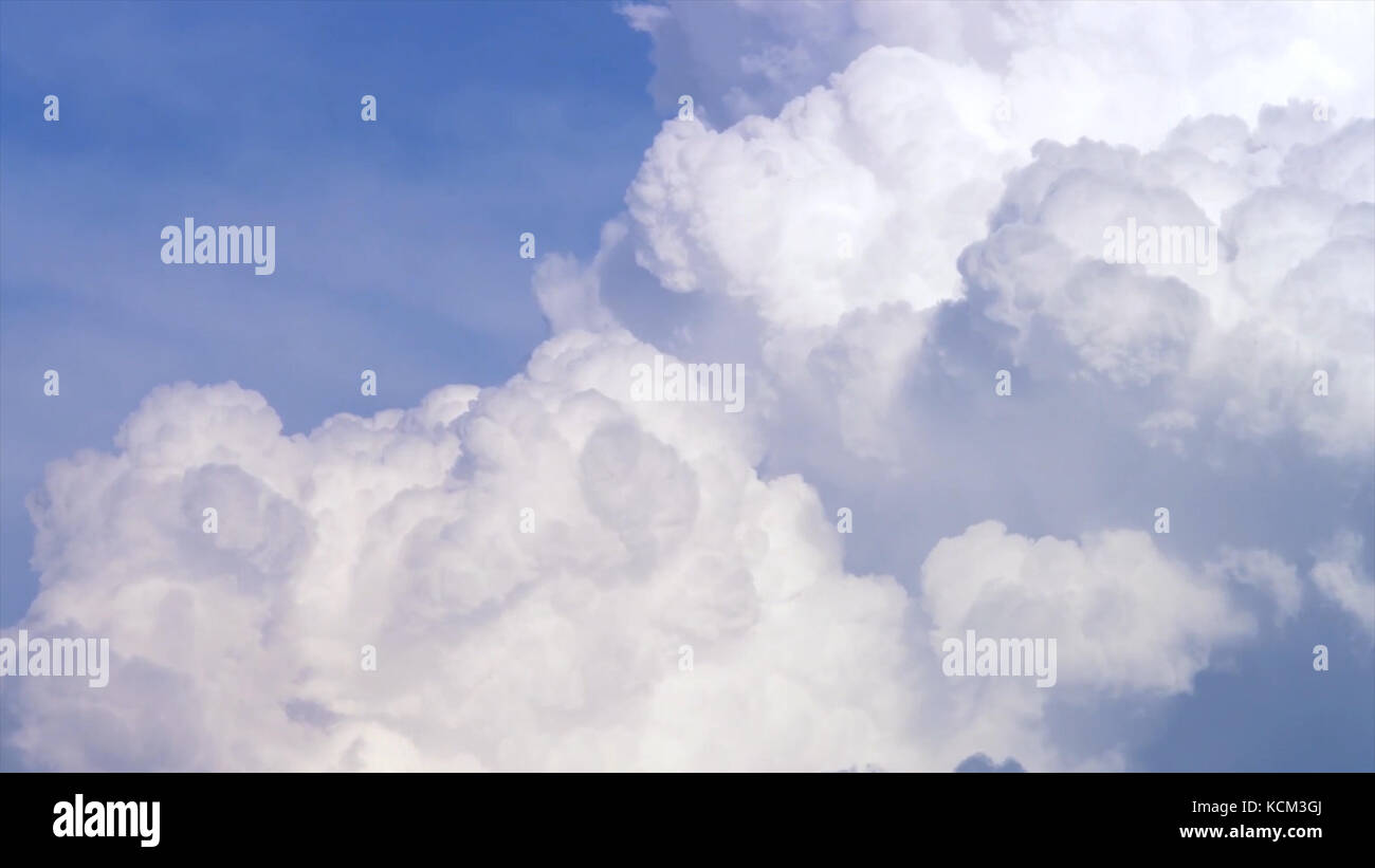 Blue sky with clouds timelapse. White big cloud on blue sky. a big and ...