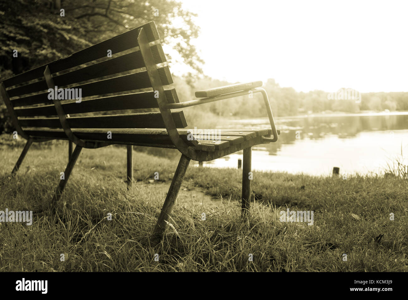 A warm bench by a lake in Denmark Stock Photo - Alamy