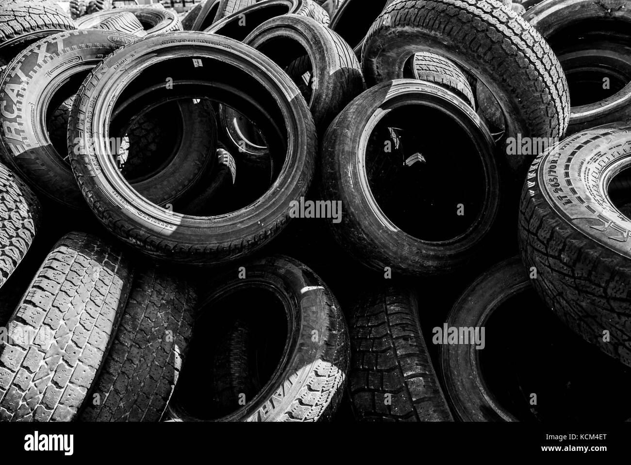 Pile of used cat tires Stock Photo - Alamy
