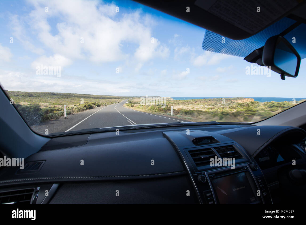 dash of car driving along coastal road Stock Photo - Alamy