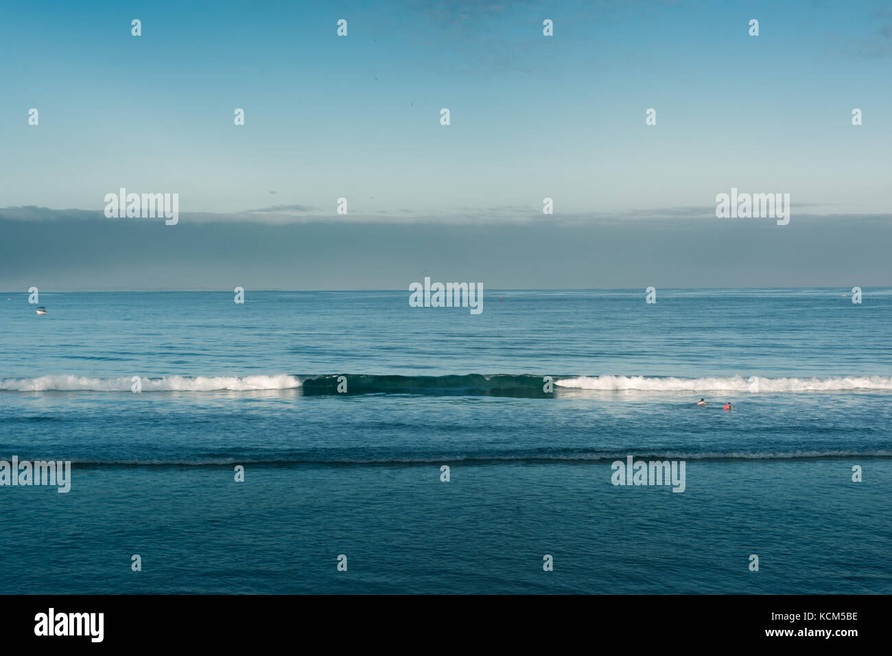 Smooth waves in ocean Stock Photo - Alamy