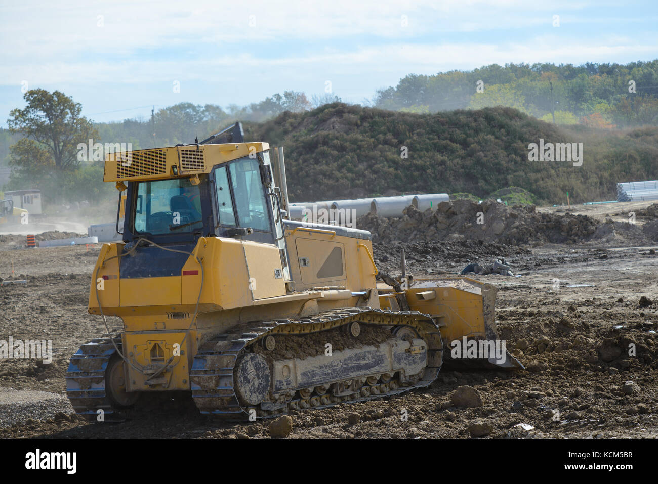 Earth moving machinery on construction site, bulldozer Stock Photo - Alamy