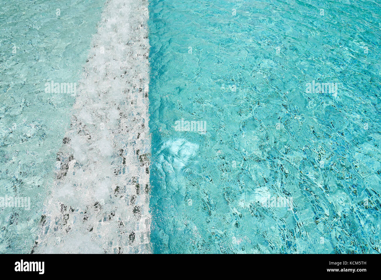 light blue swimming pool rippled water for background Stock Photo - Alamy