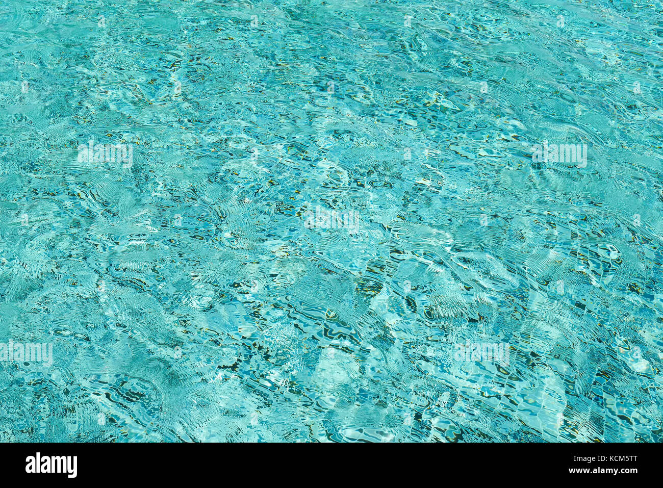light blue swimming pool rippled water for background Stock Photo - Alamy