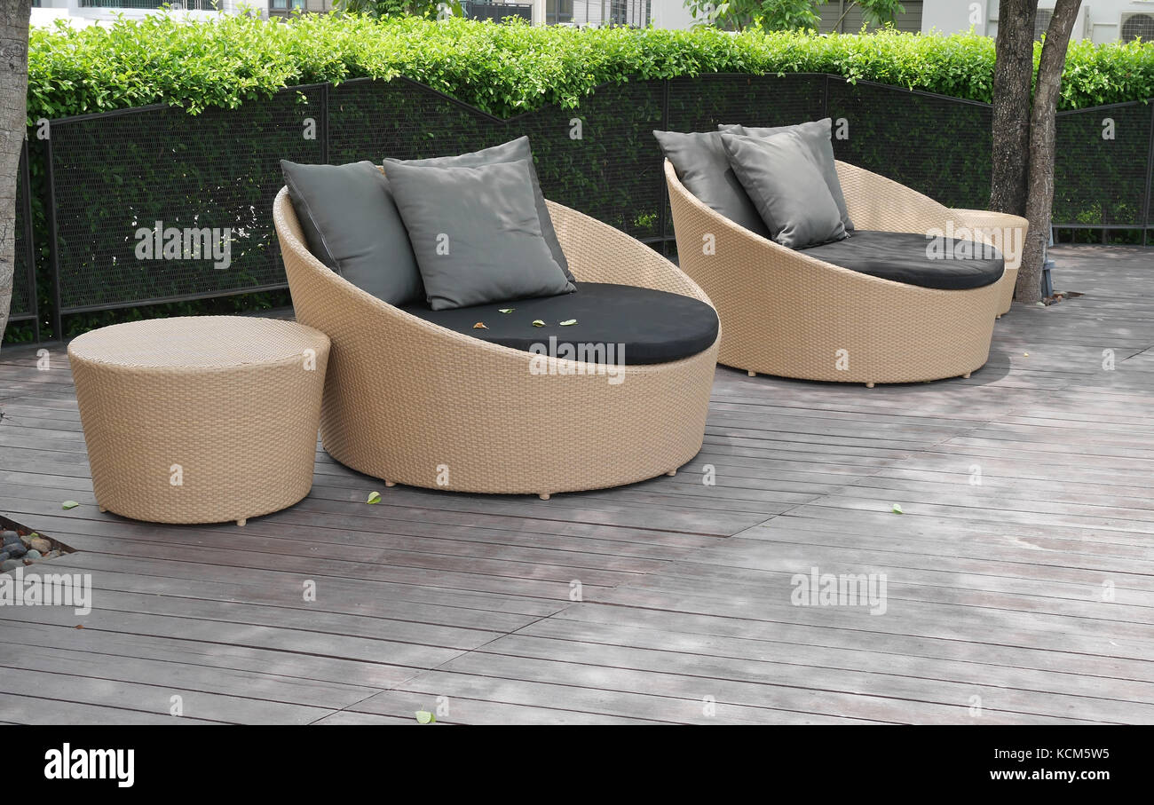 Outdoor artificial rattan on wooden floor Stock Photo - Alamy