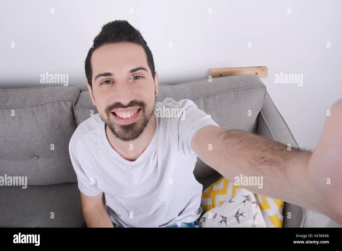 Attractive young man taking selfie. Indoors Stock Photo - Alamy Attractive young man taking selfie. Indoors Stock Photo - Alamy