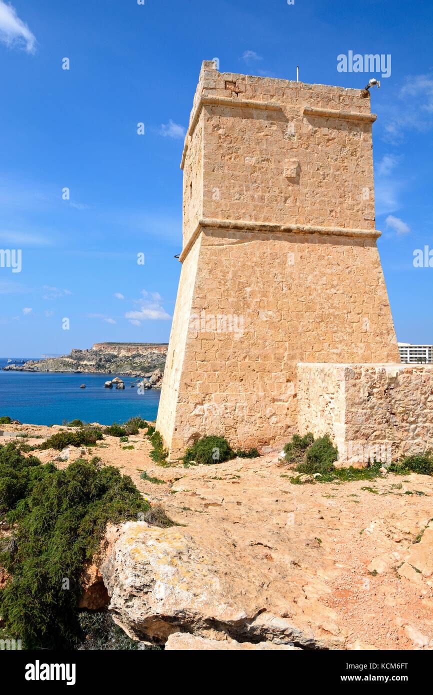 Ghajn Tuffieha watchtower overlooking the sea and cliffs, Golden Bay ...
