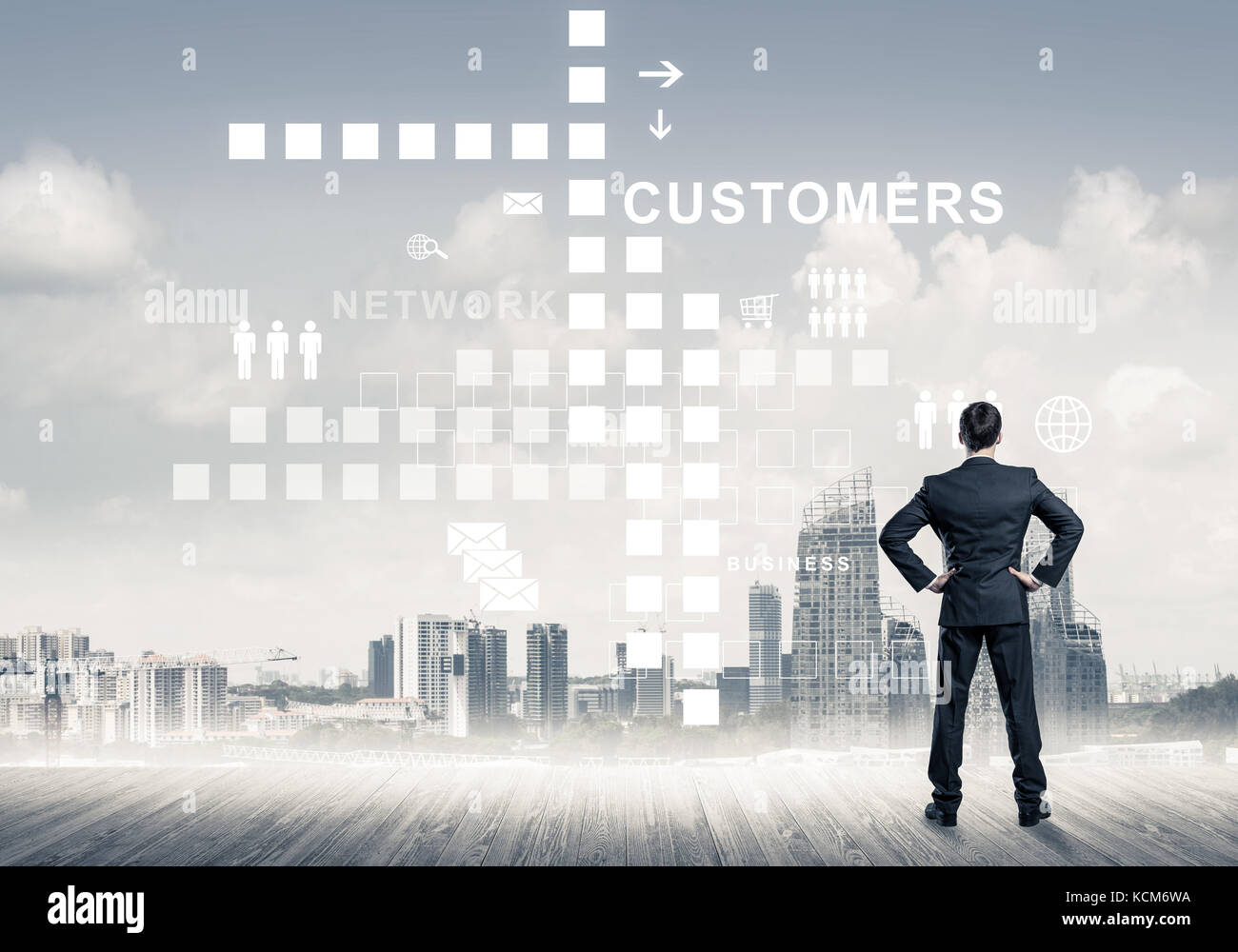 Pensive businessman looking at user interface against modern cit Stock ...