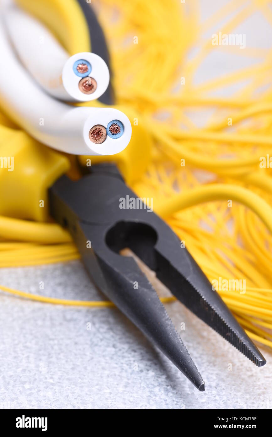 Tools and cables used in electrical home installation, closeup Stock ...