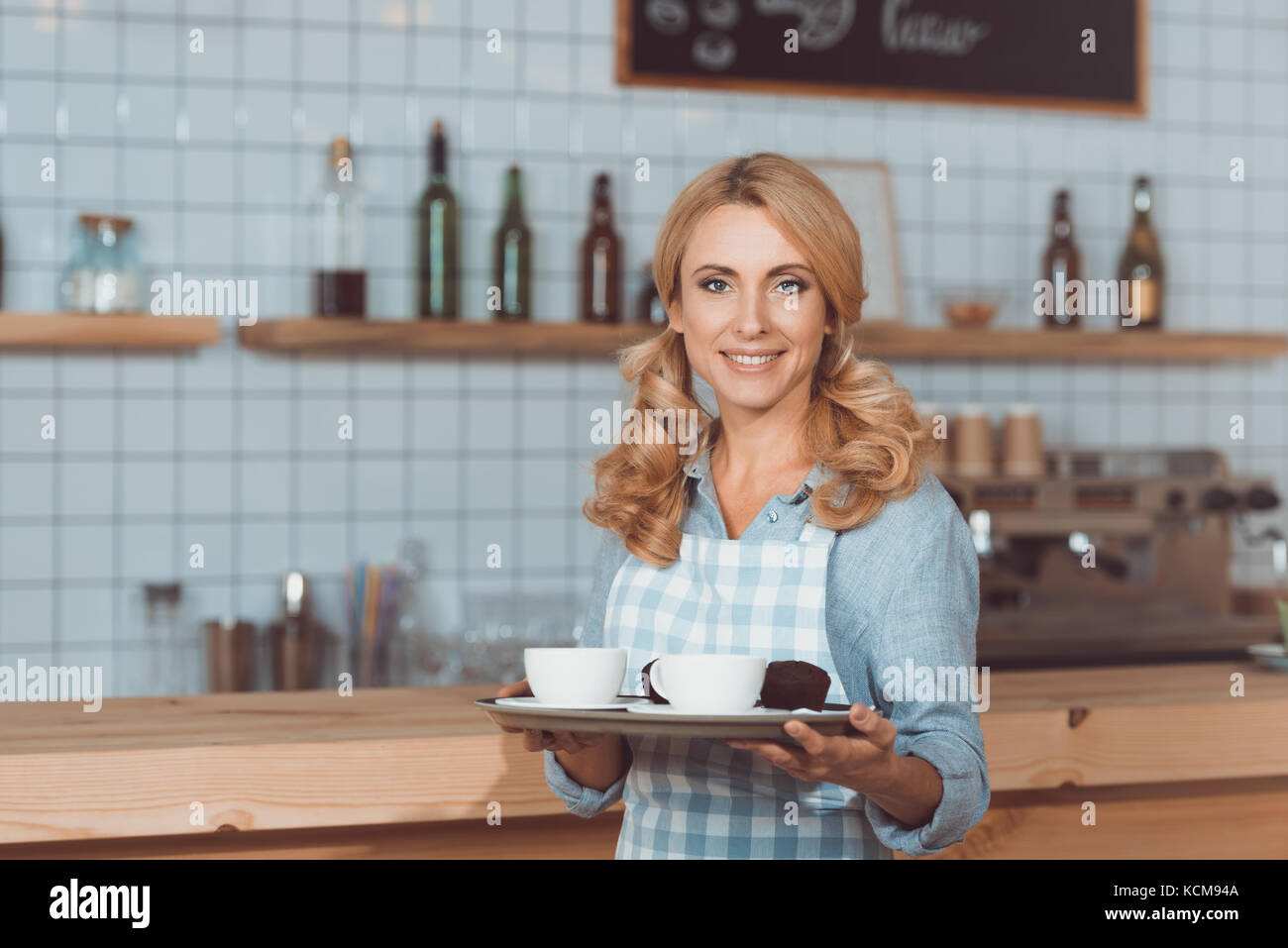 waitress with utensils and tray Stock Photo - Alamy