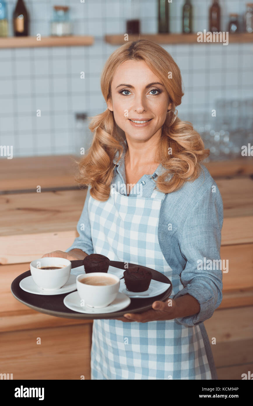 waitress with utensils and tray Stock Photo - Alamy