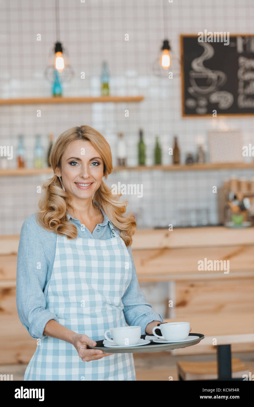 waitress with utensils and tray Stock Photo - Alamy