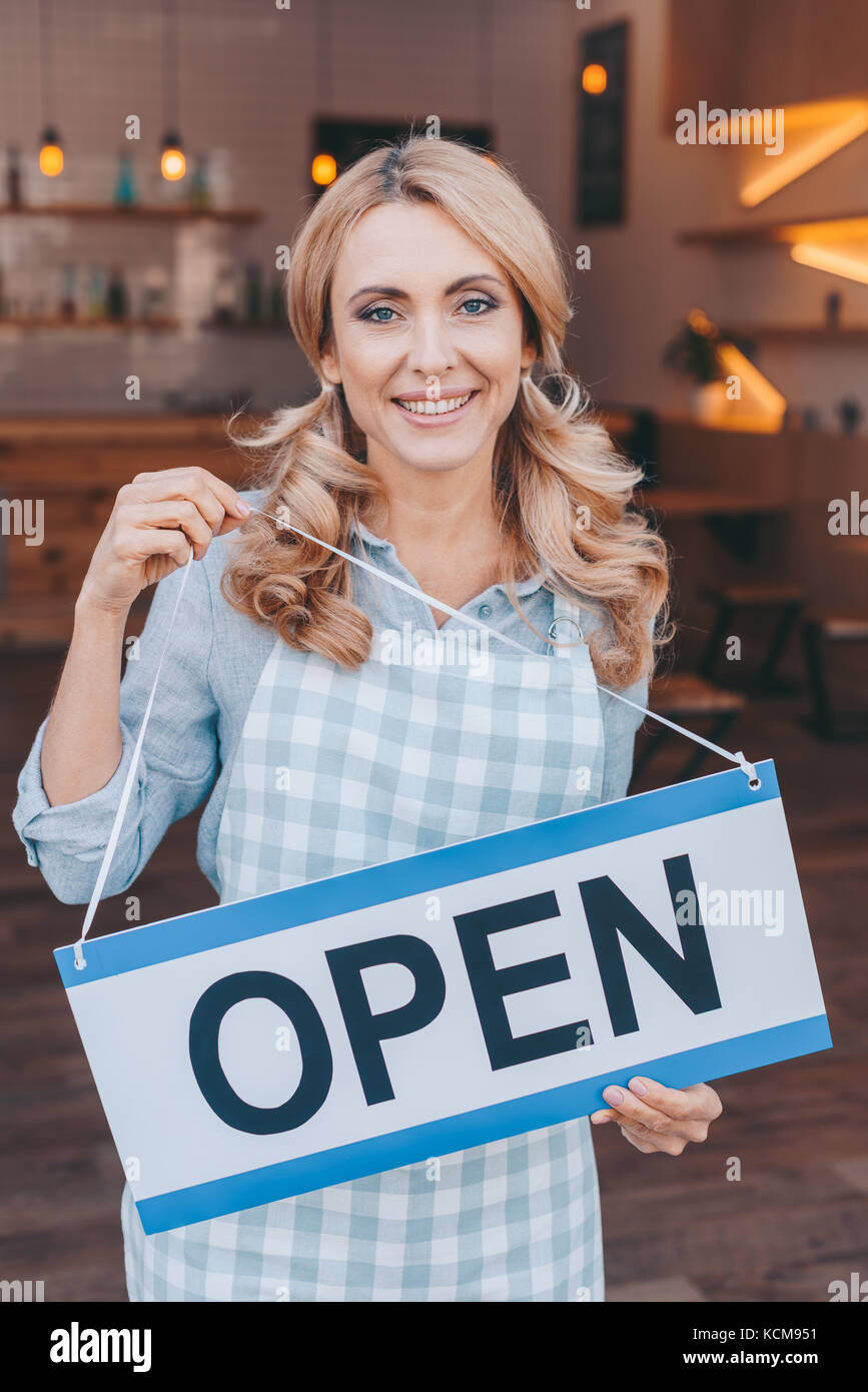 waitress with sign open Stock Photo - Alamy