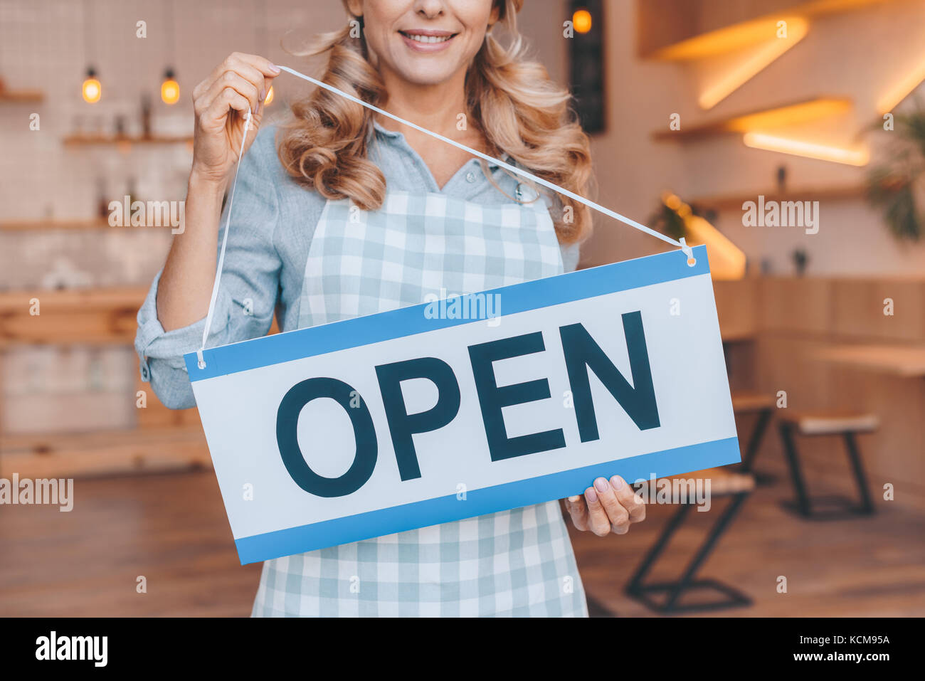 waitress with sign open Stock Photo - Alamy