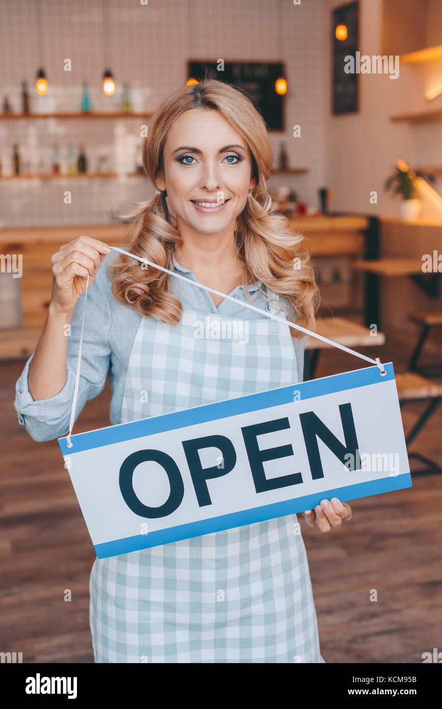 waitress with sign open Stock Photo - Alamy