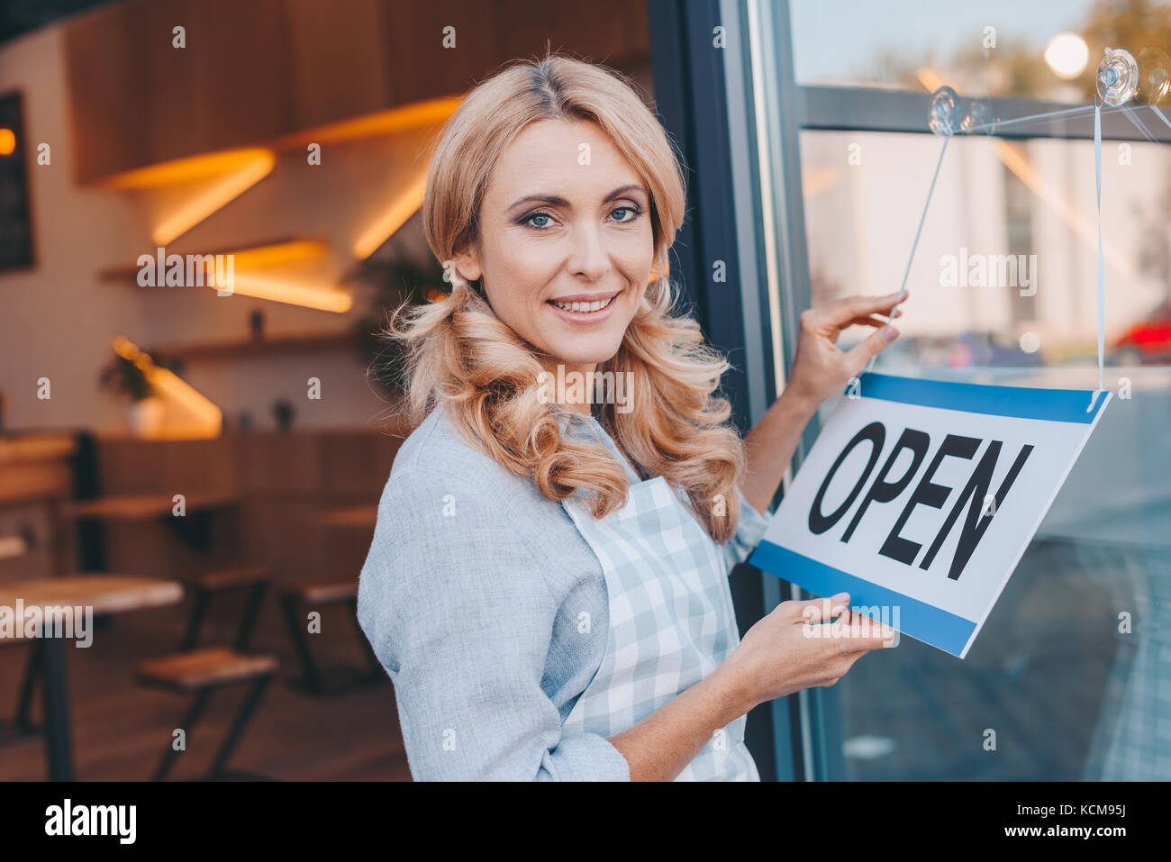 waitress with sign open Stock Photo - Alamy